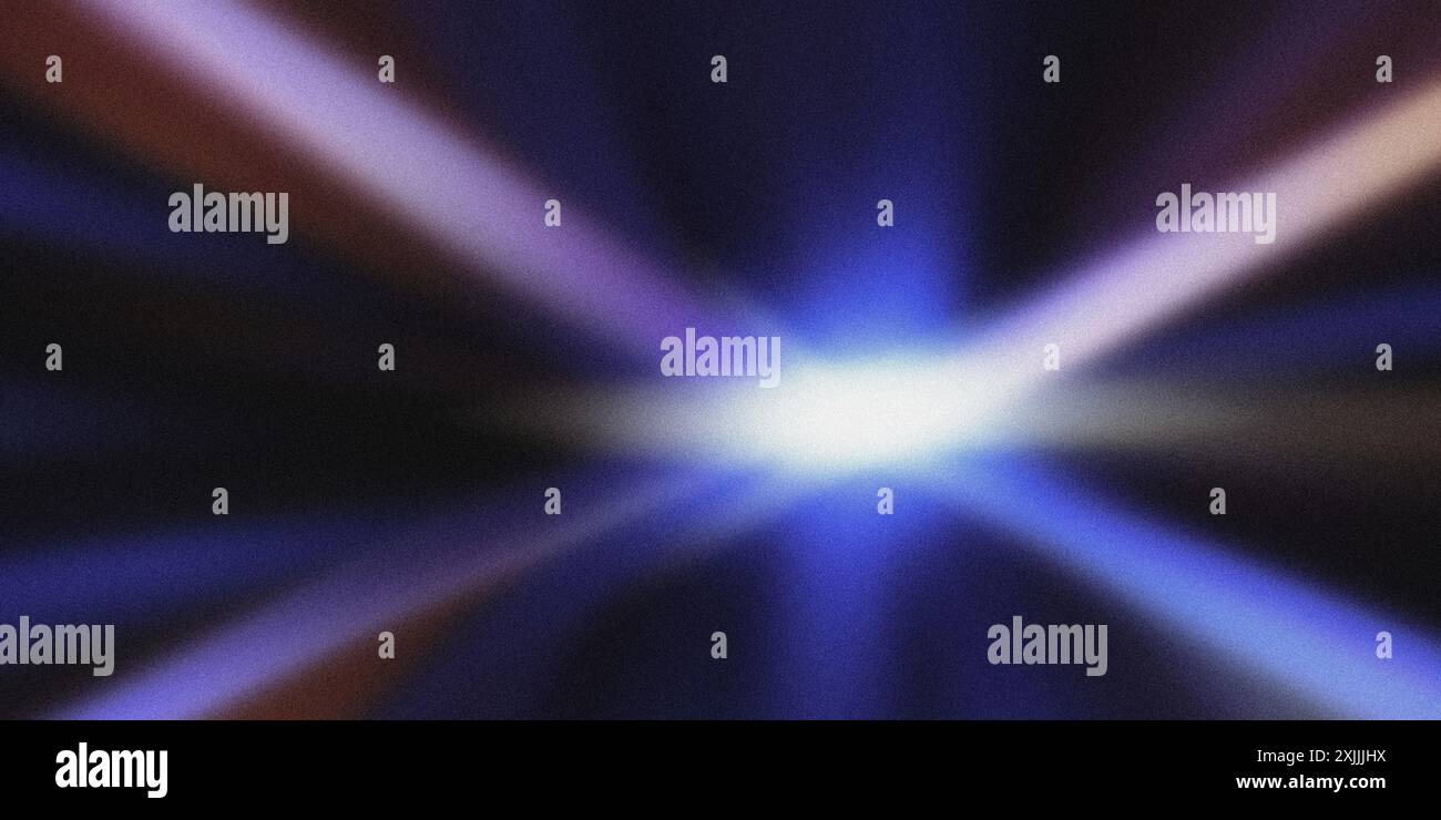 Bright light shining through a dark blue background, creating a beam of ...