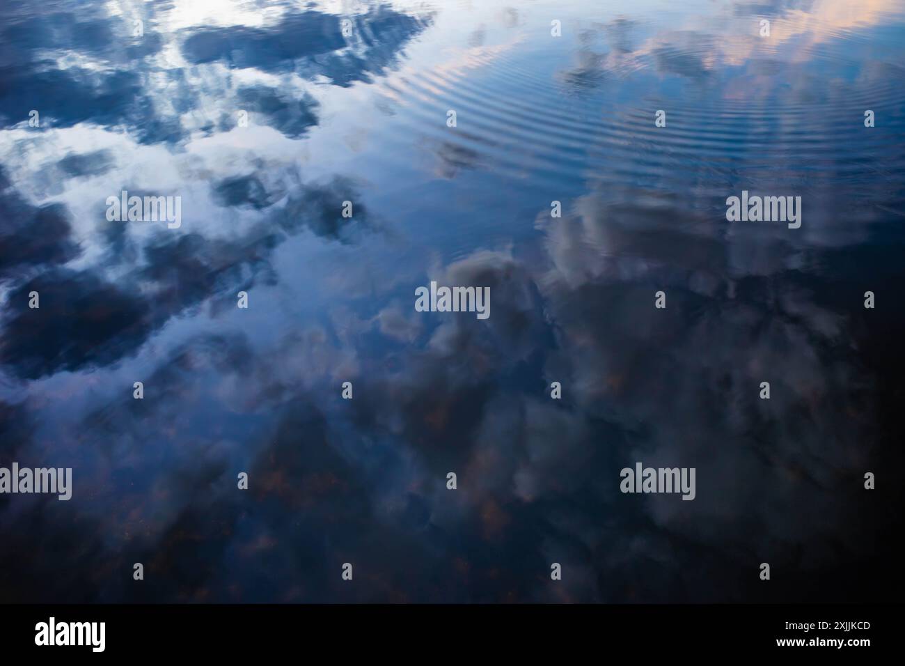 Clouds Reflecting on Calm Water in Cape Coral Florida Stock Photo - Alamy