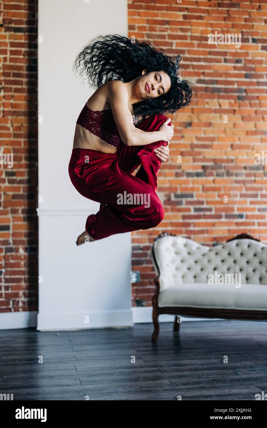 Cheerful woman in red outfit hi-res stock photography and images - Alamy