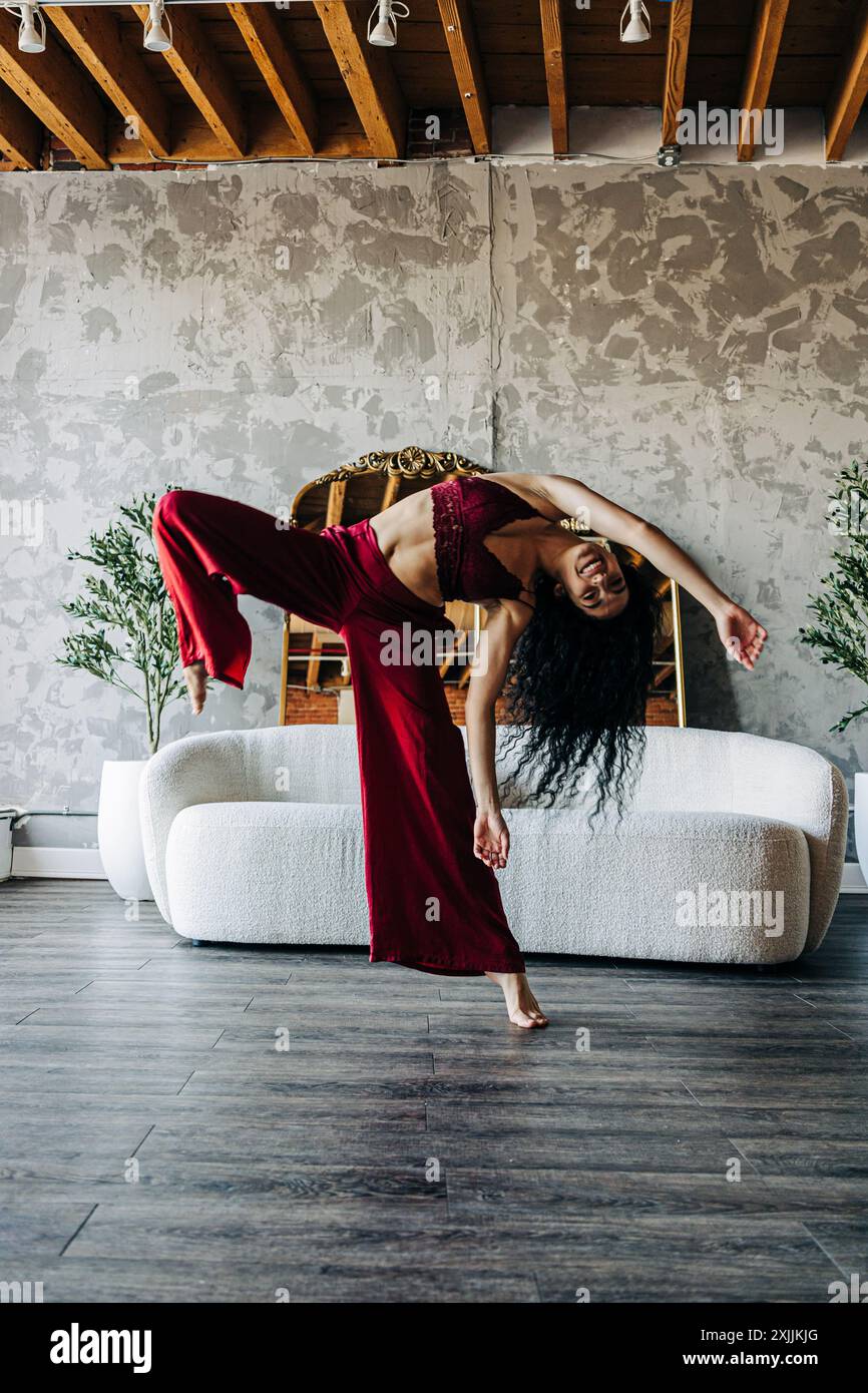 Joyful woman dancing energetically hi-res stock photography and images ...