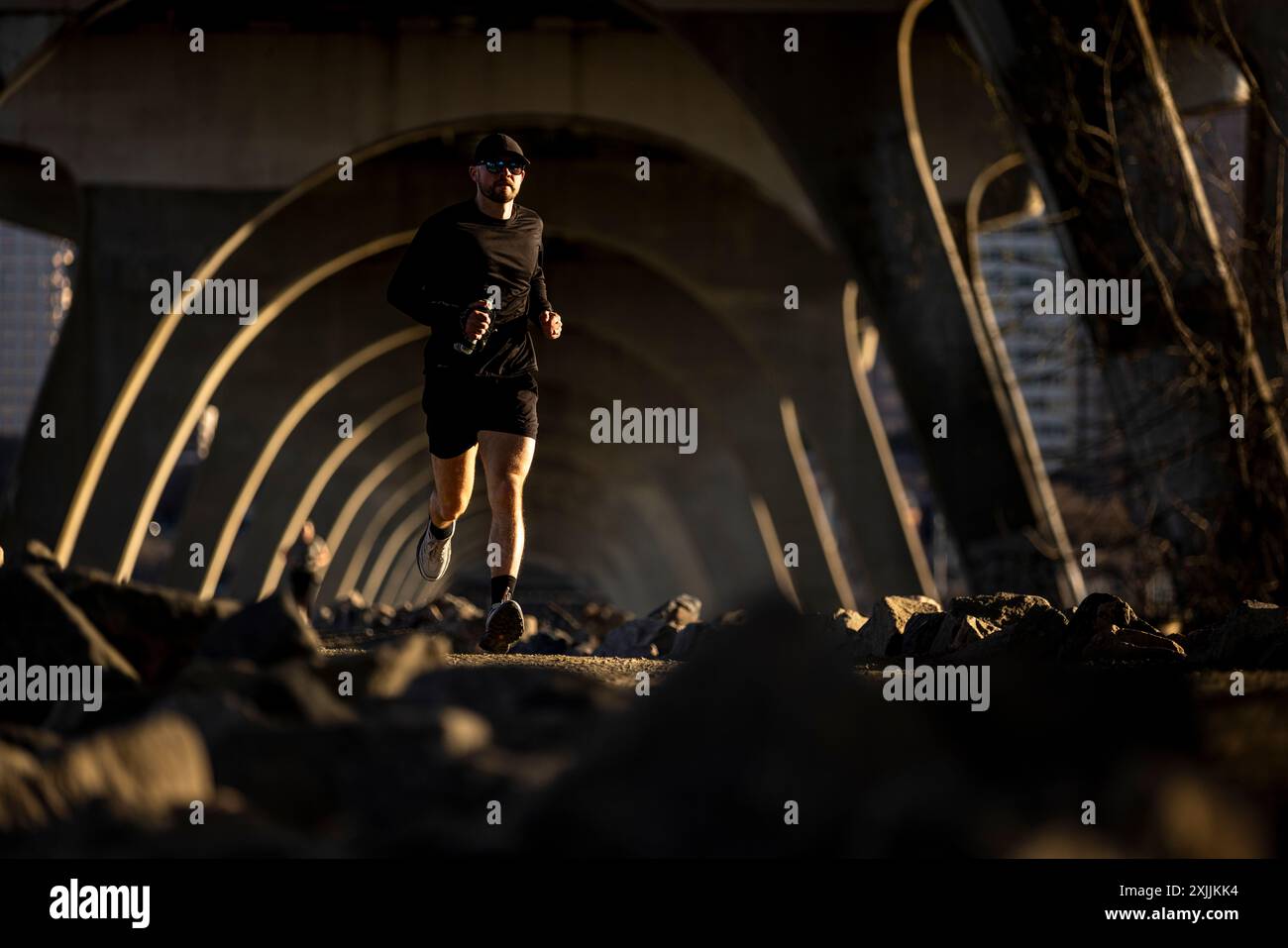 Mid 20s male trail running Stock Photo - Alamy