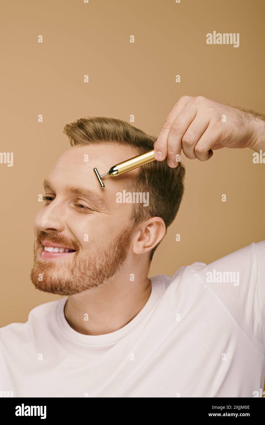 Man using roller brush hi-res stock photography and images - Alamy