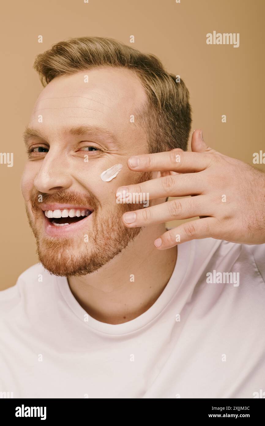 Handsome young man applying face hi-res stock photography and images ...