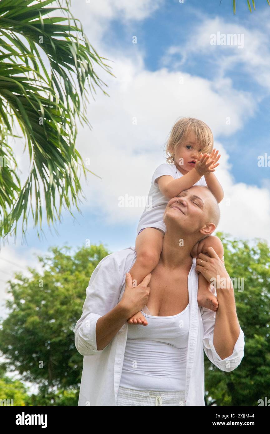 Environmental portrait of a mother with toddler on her shoulder Stock ...