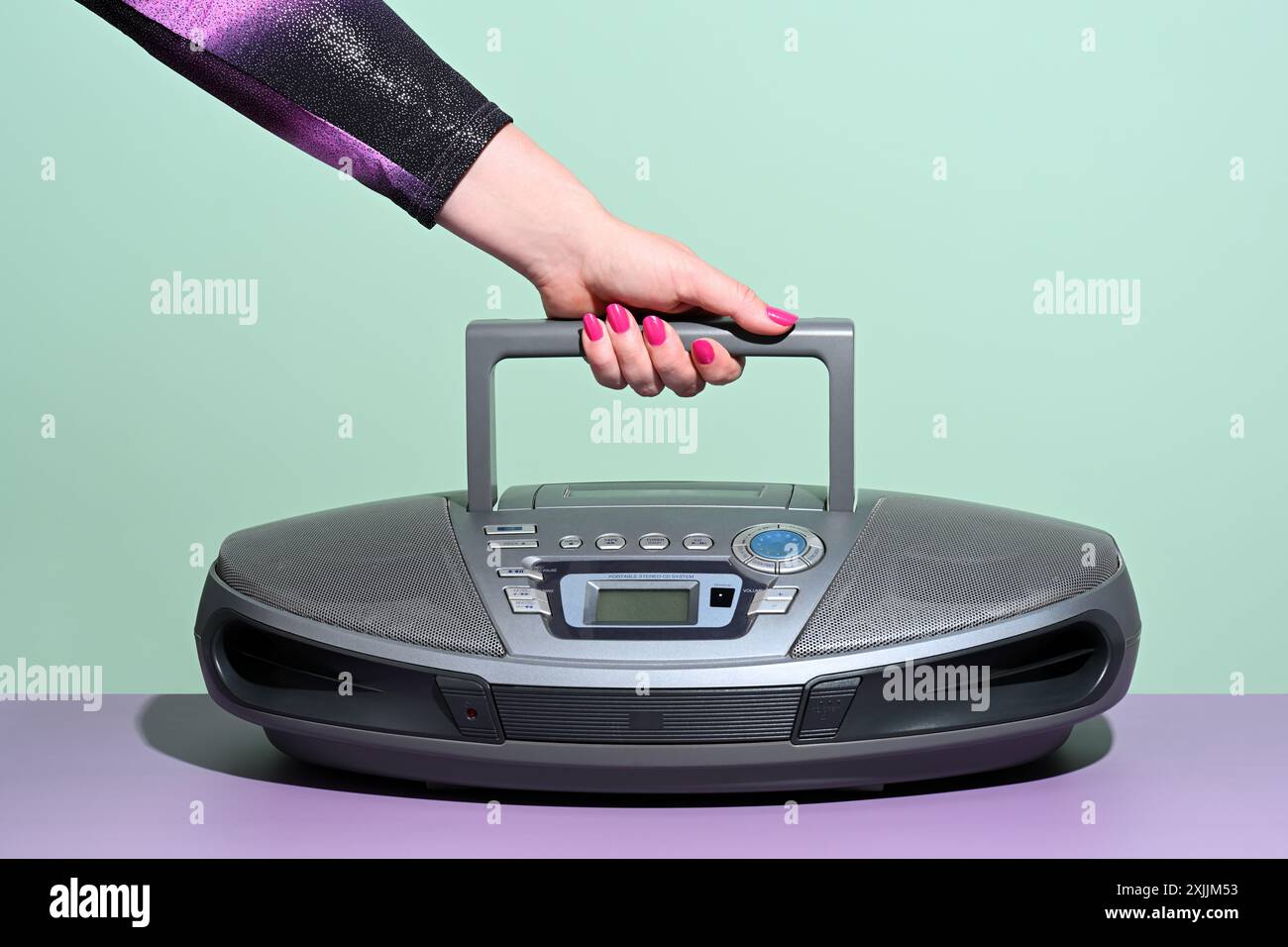 Female hand holding vintage tape, cd recorder Stock Photo - Alamy