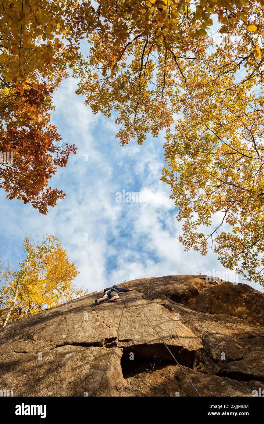Rock Climber Surrounded by Autumn Foliage Stock Photo - Alamy