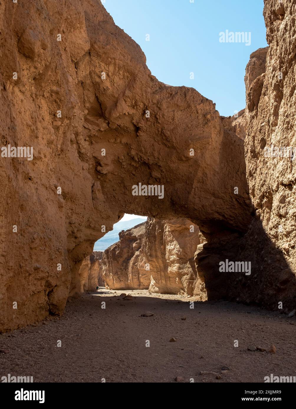 A large rock archway in a desert called Natural Bridge Stock Photo - Alamy