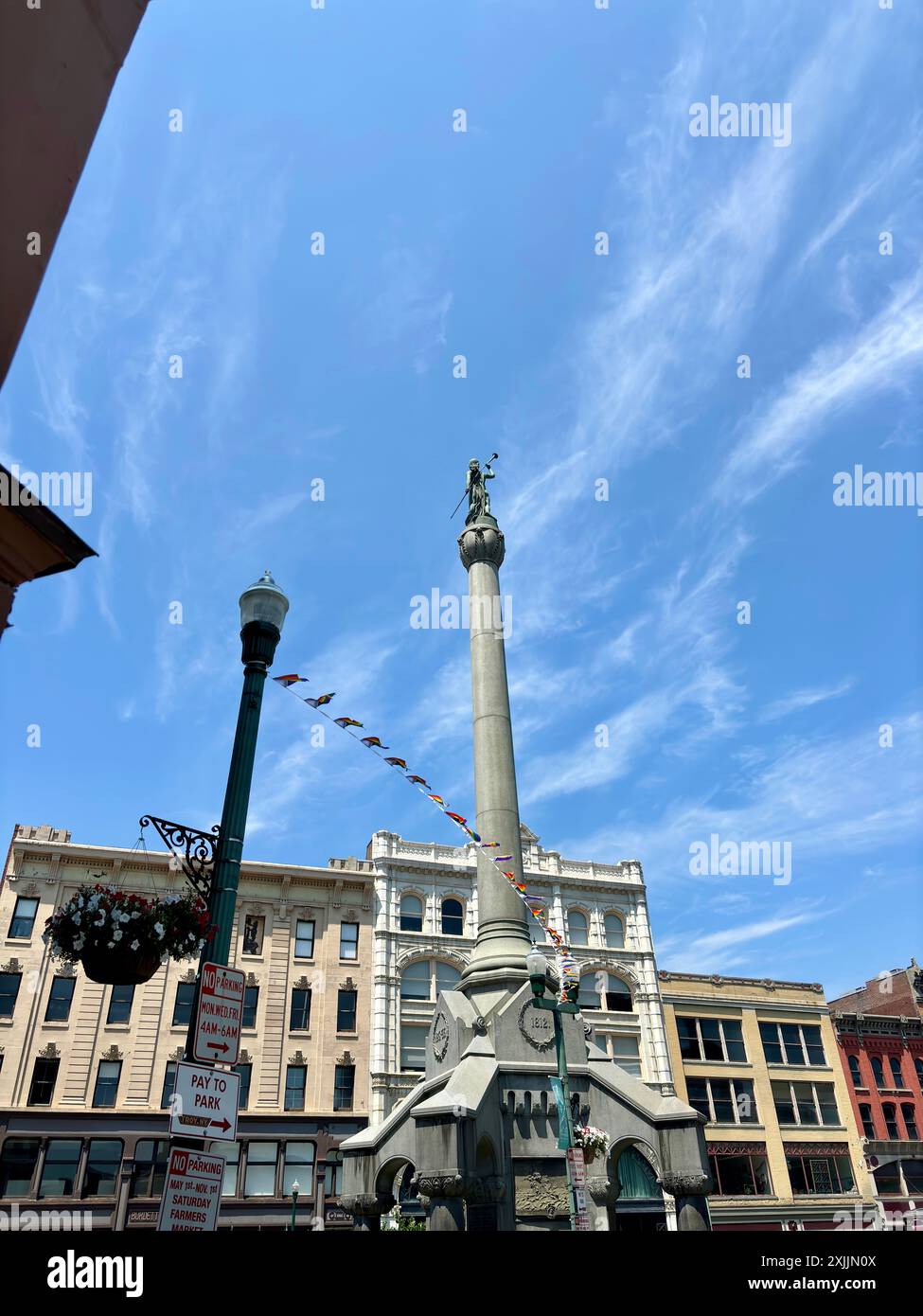 Monument and historic buildings in Troy, NY against clear blue sky ...