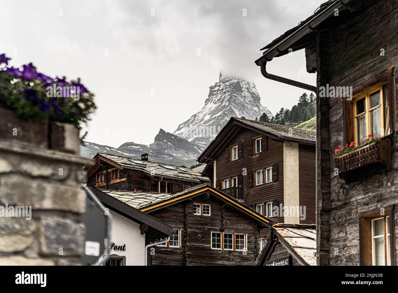 Wood alpine houses with Matterhorn on background, Zermatt Stock Photo ...
