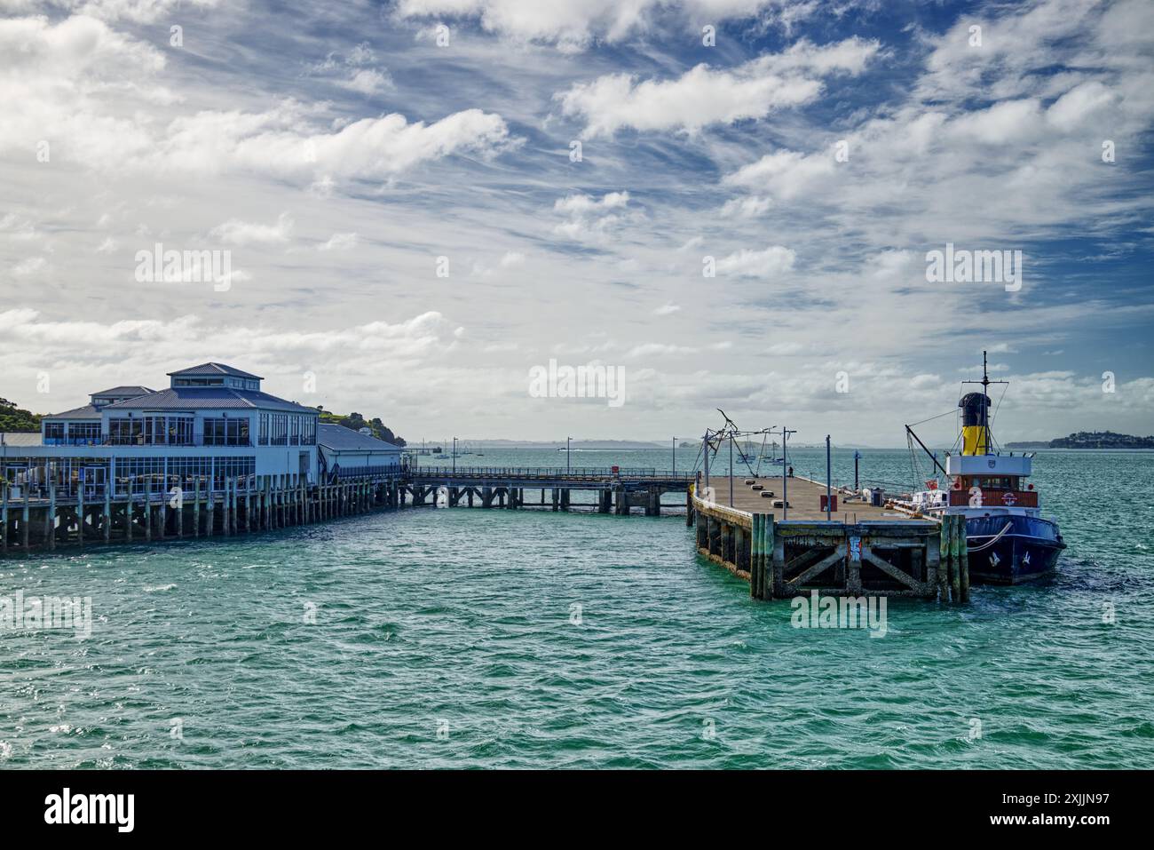 Auckland, New Zealand - Devonport Ferry Terminal with pier and tugboat ...