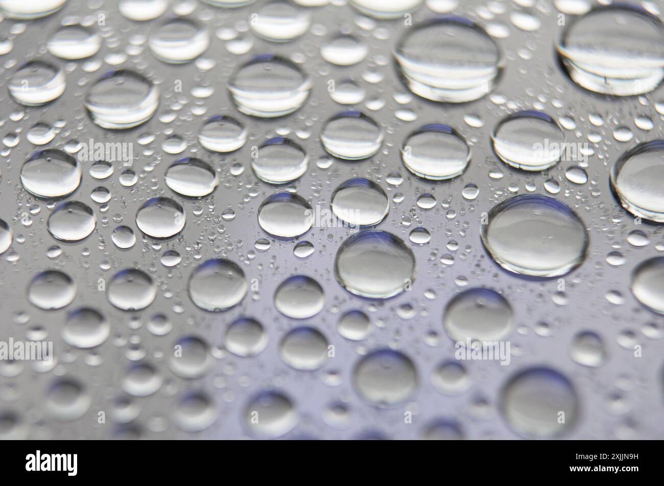 Close up view of water droplets on clear glass suitable for design and ...