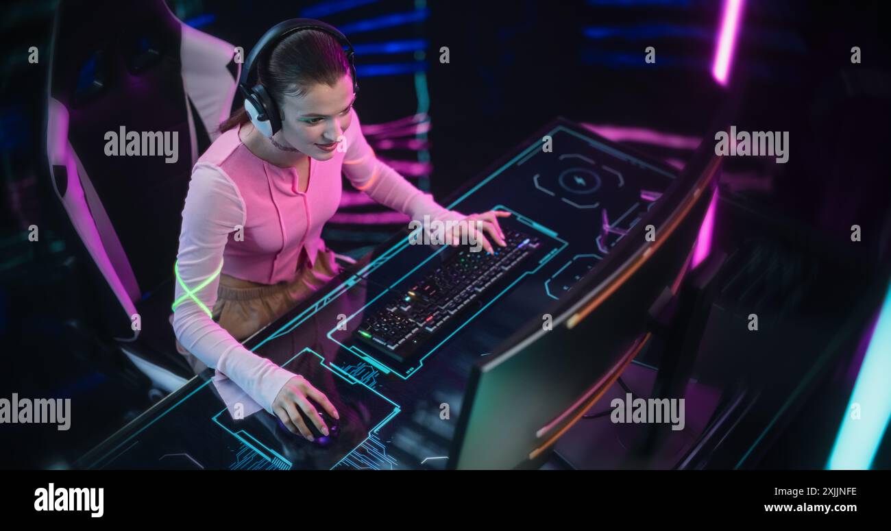 Young Woman Wearing Futuristic Pink Clothes and Neon Rings, Playing ...