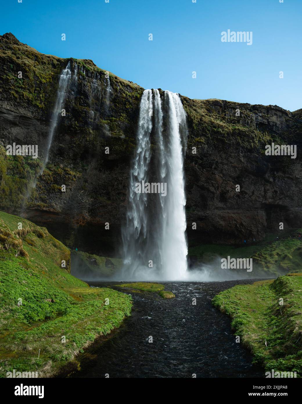 A tall waterfall in Iceland Stock Photo - Alamy
