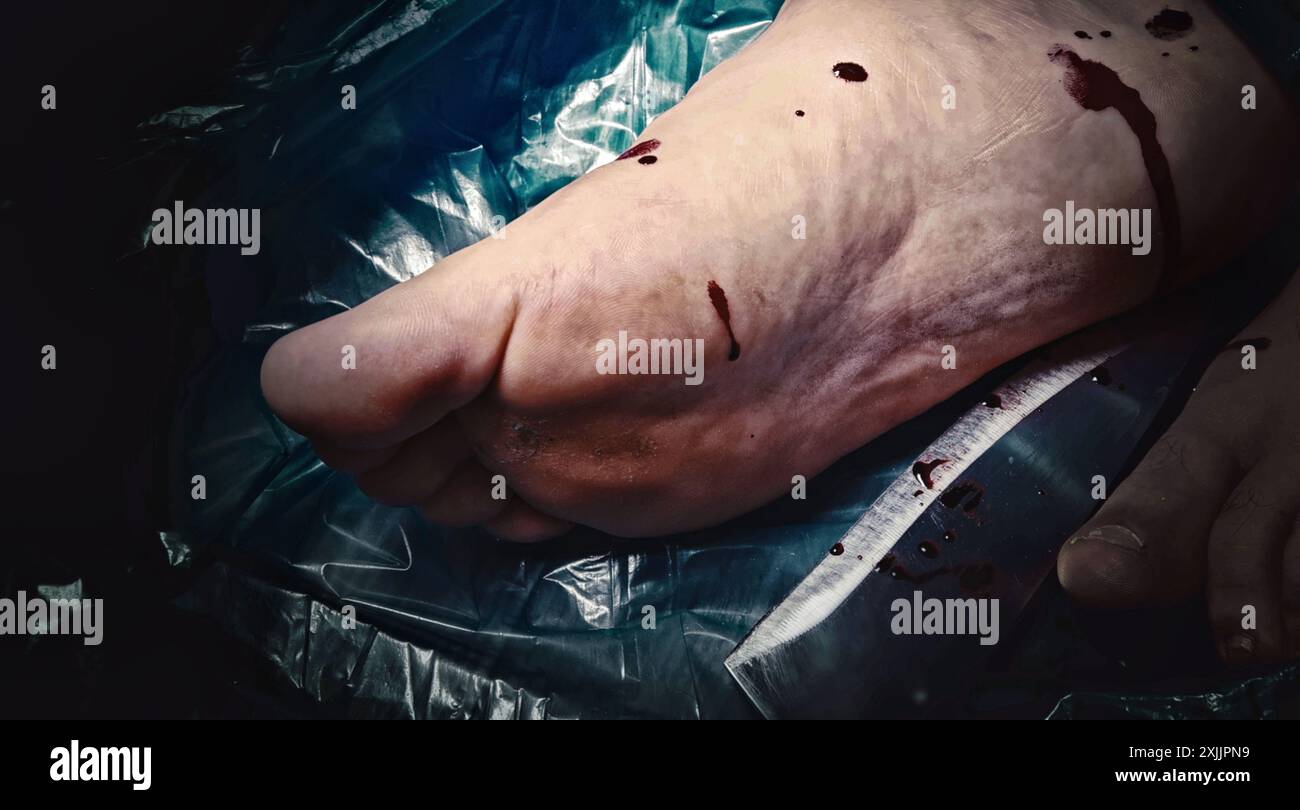 A dead body covered in blood and a knife at the murder scene Photo ...