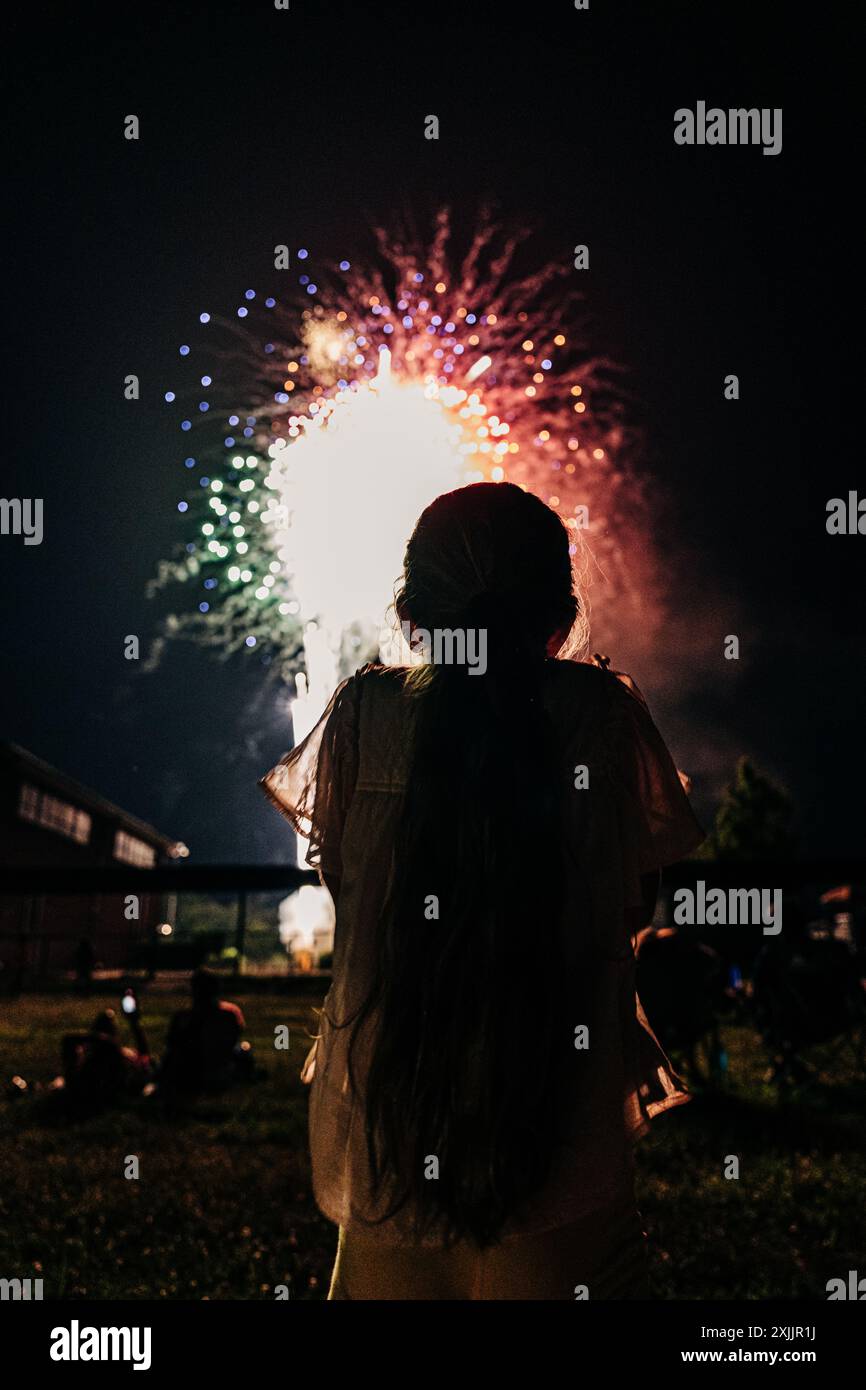 Happy girl watching fireworks hi-res stock photography and images - Alamy