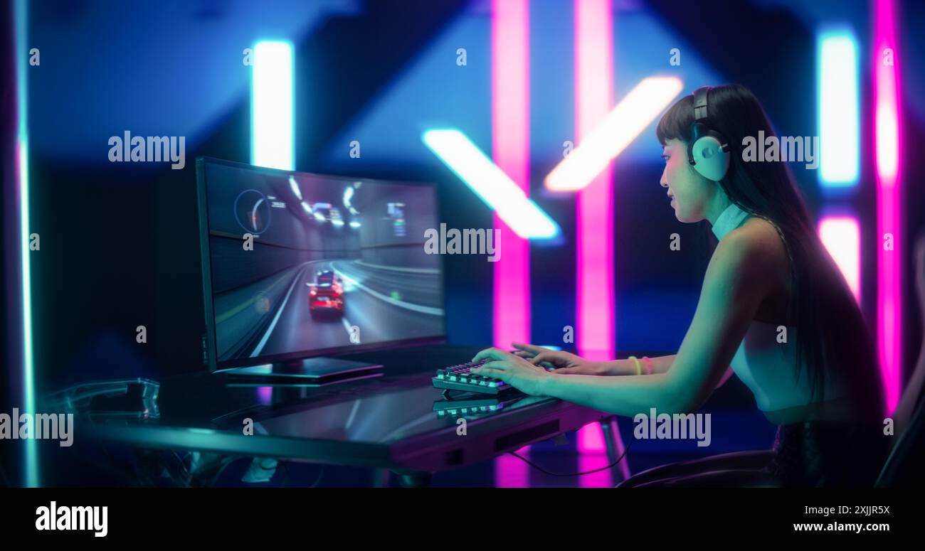 Young Japanese Female Gamer Playing Online Racing Game on Computer ...