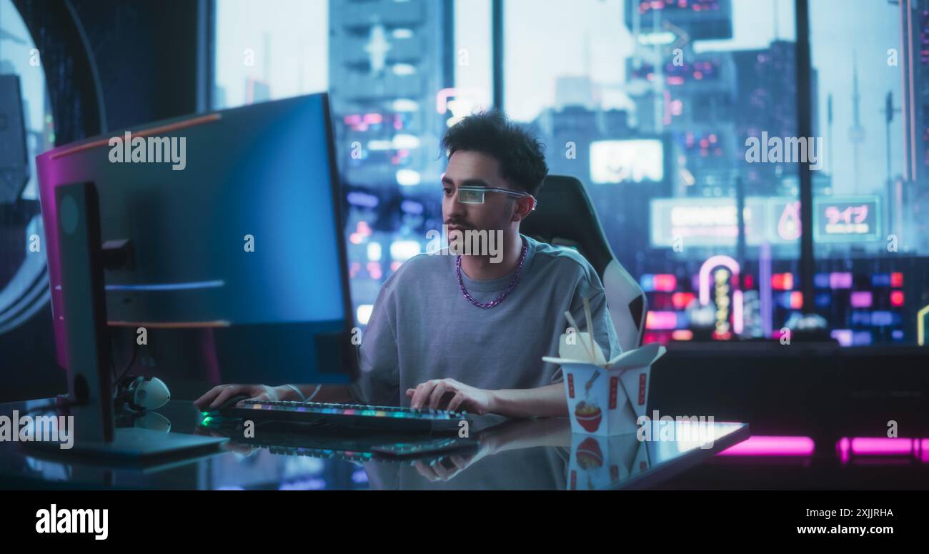 Handsome Young Man Eating Take-Away Asian Food, while Working on a ...