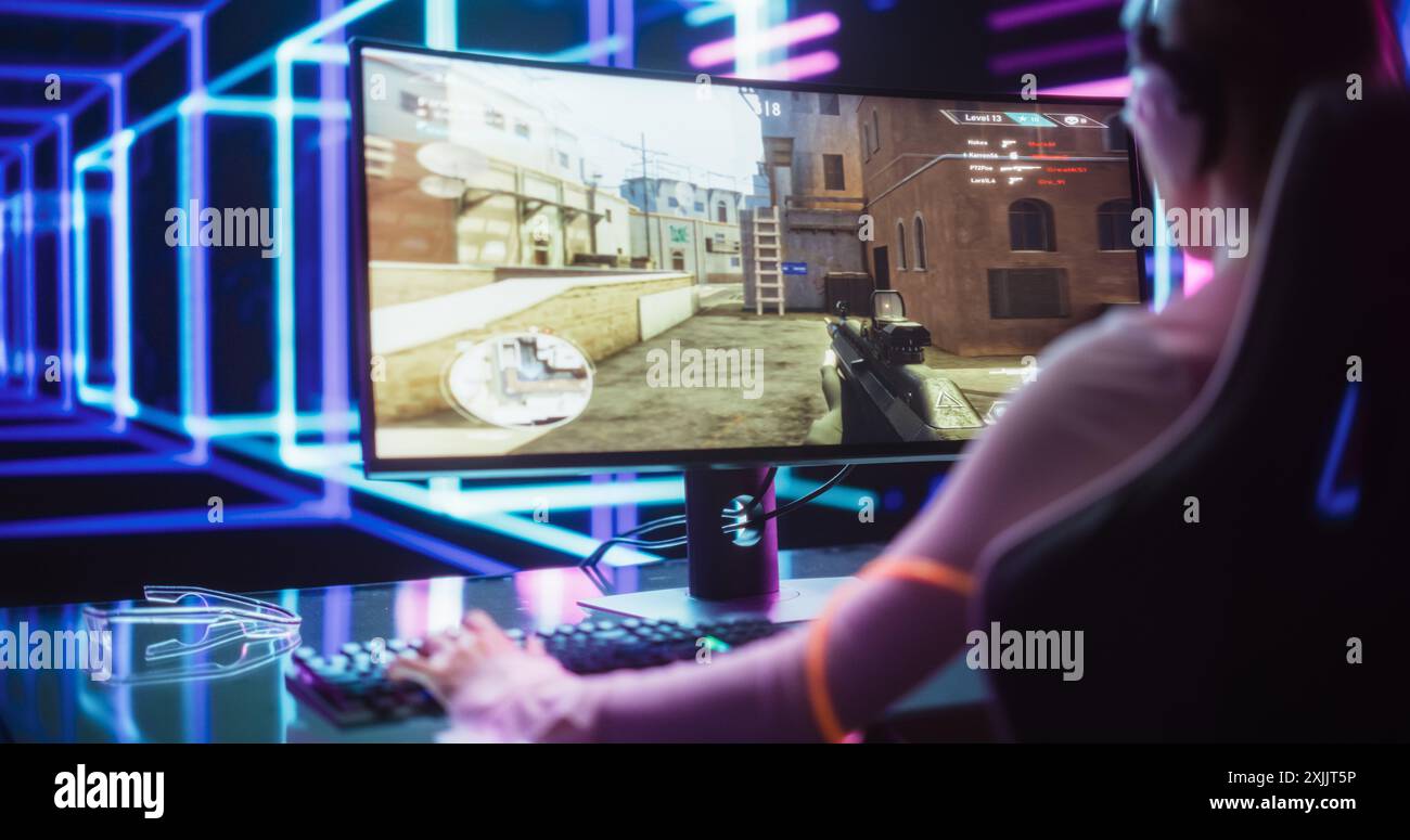 Young Female Professional Gamer Competing in an E-Sports Championship ...