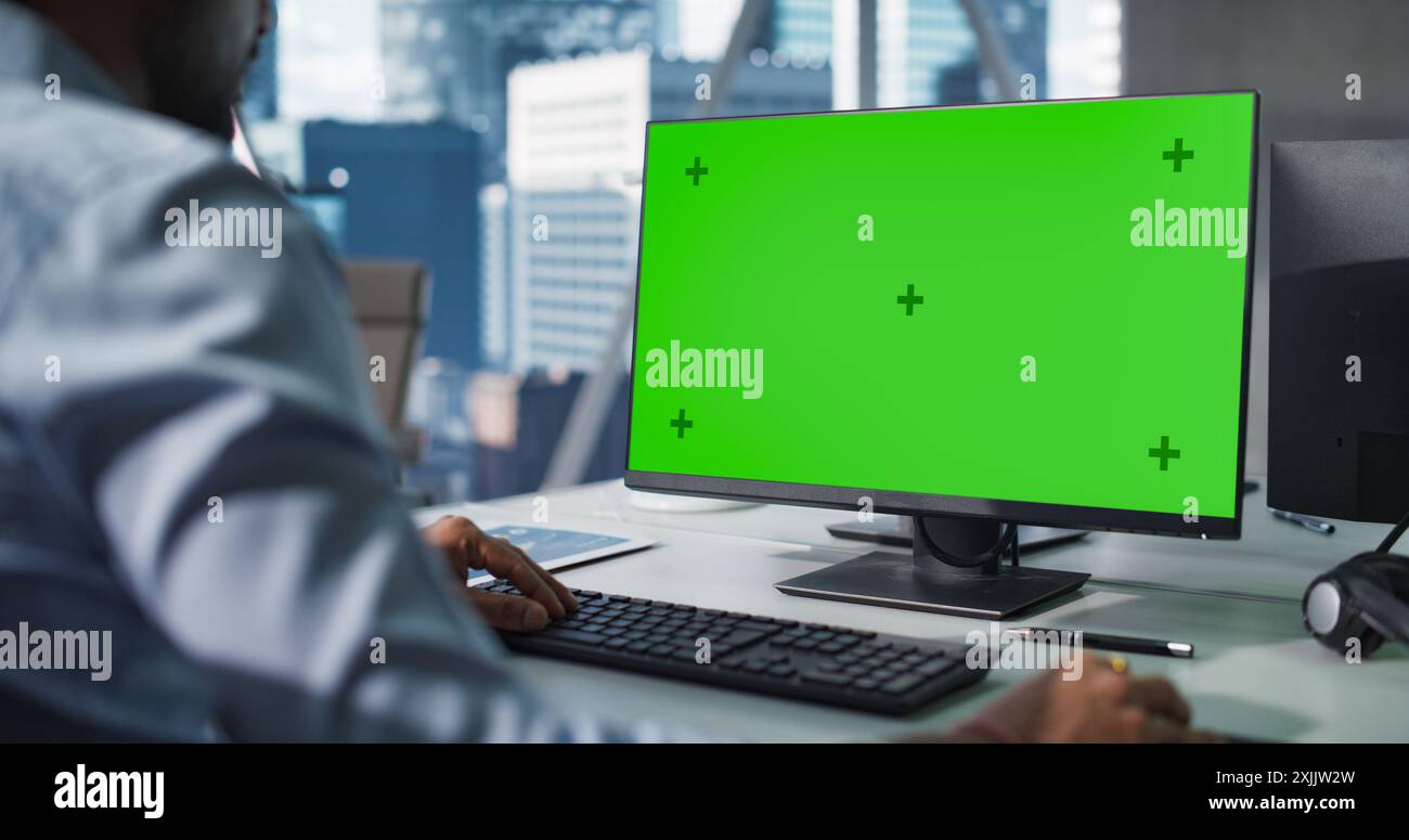 Indian Chief Financial Officer Working on Desktop Computer with Green ...