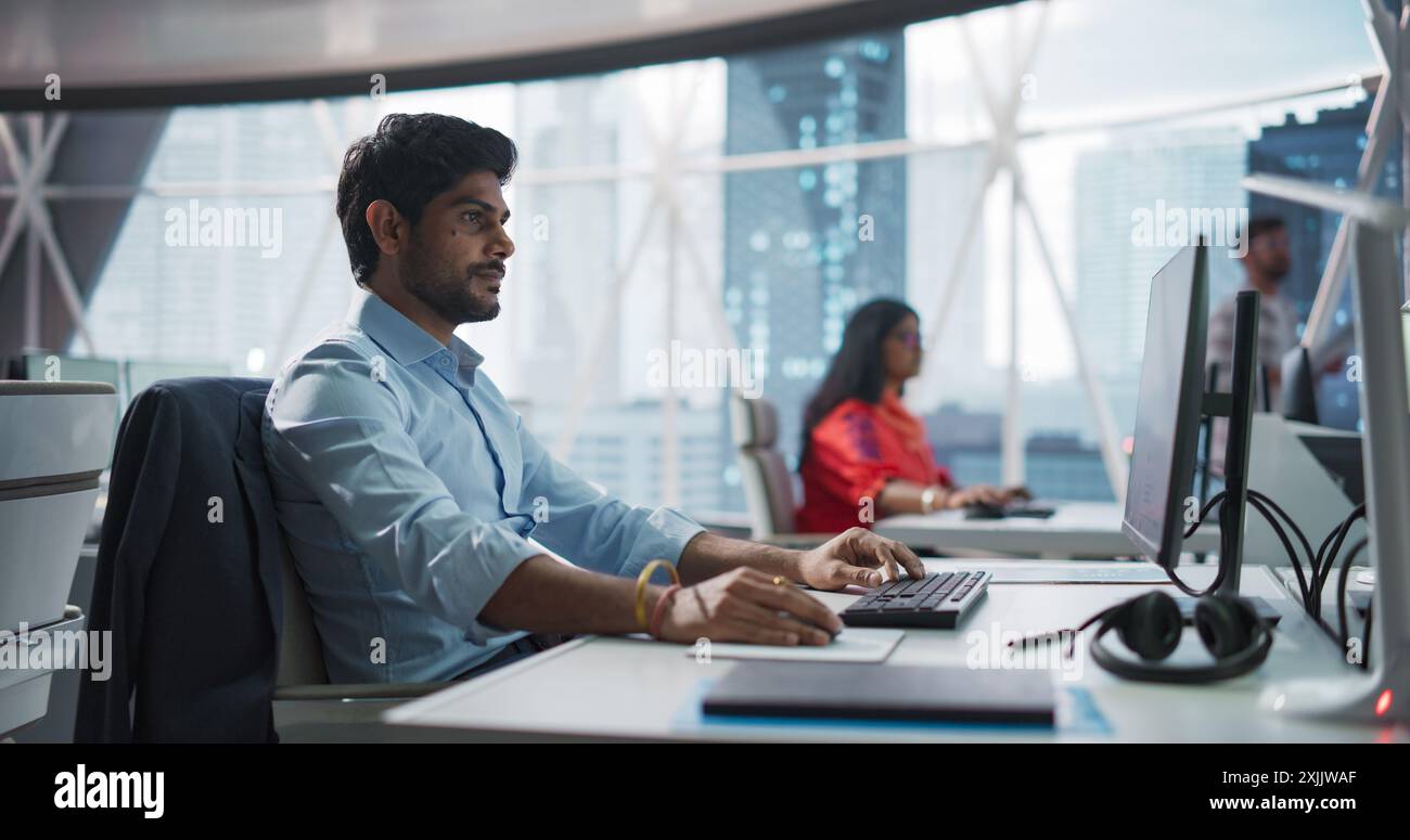 Portrait of an Indian Businessman Working on a Desktop Computer in a ...