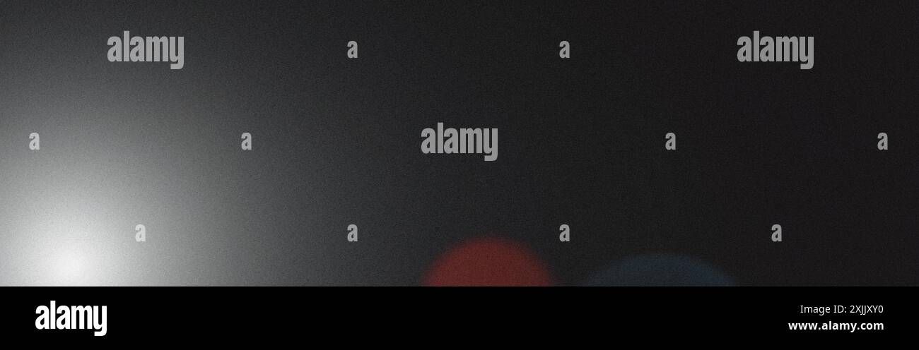 Light is reflecting on a black grainy surface creating a gradient from ...