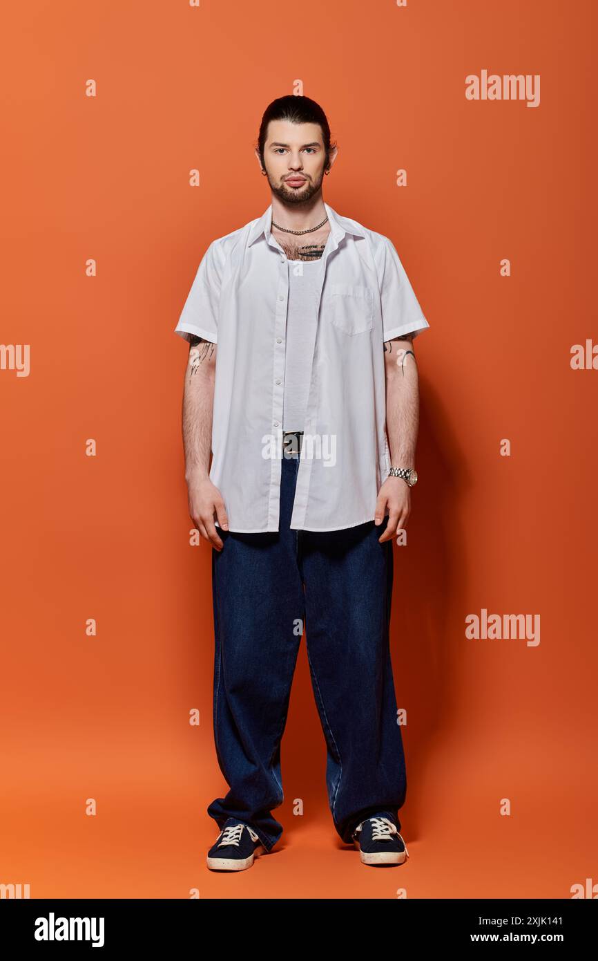 A stylish Caucasian man standing confidently in front of a bright ...