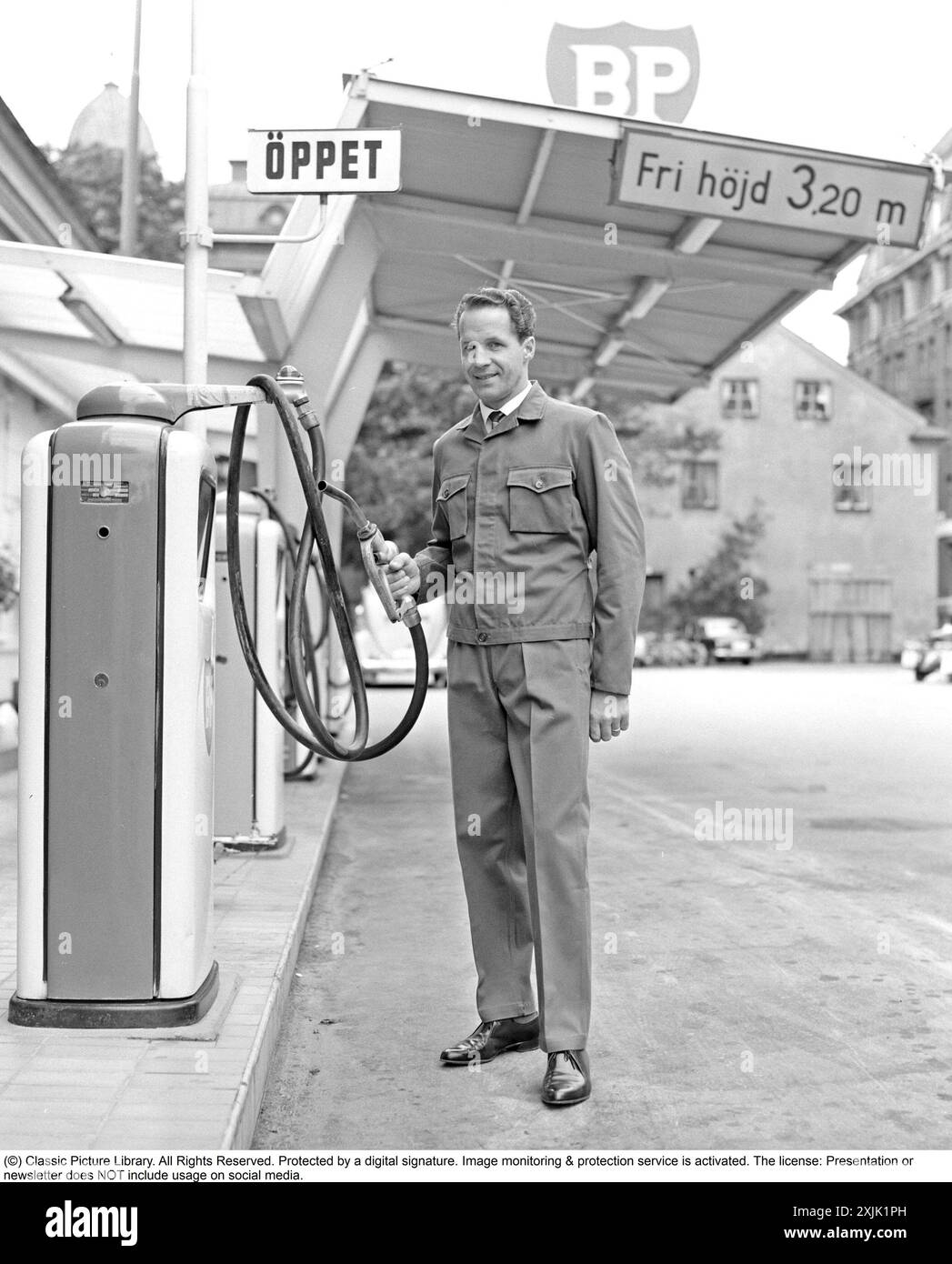 BP petrol station in 1961. A male attendant looks very service minded ...