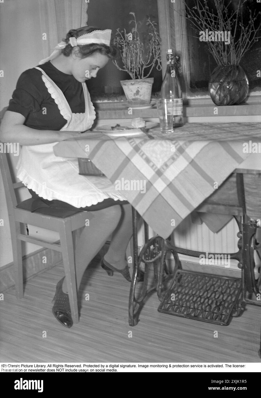 Living in the 1940s. A young woman working as a maid and the ...