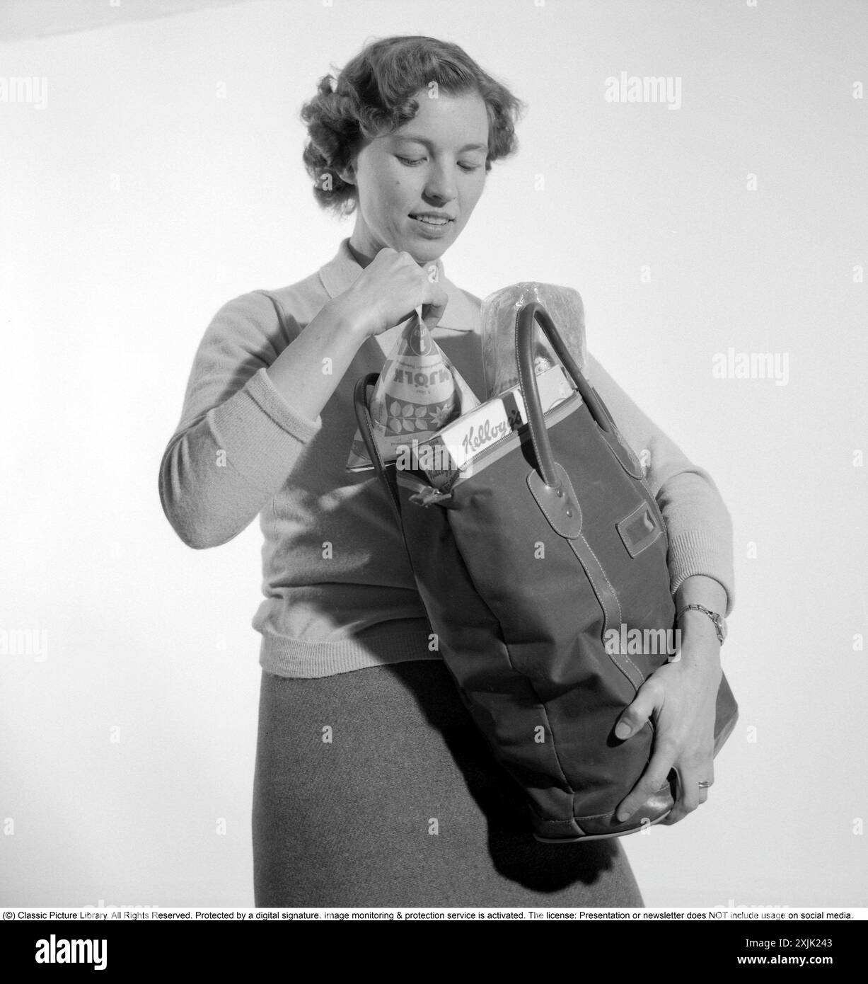 In the 1960s. A woman with her shopping bag. The classic Tetran milk ...