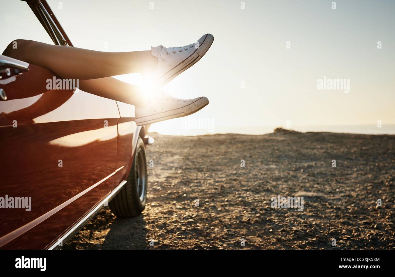 Road trip, car and feet out window with sunset for travel, summer ...