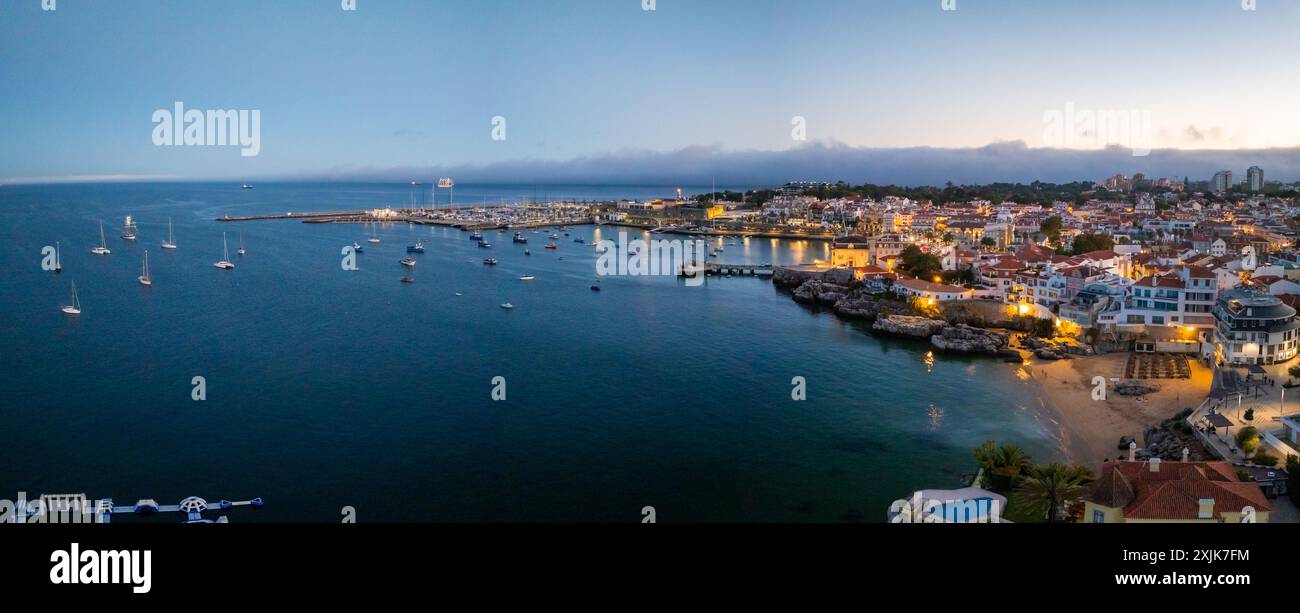 Aerial view of Praia da Rainha and historic city centre of Cascais ...
