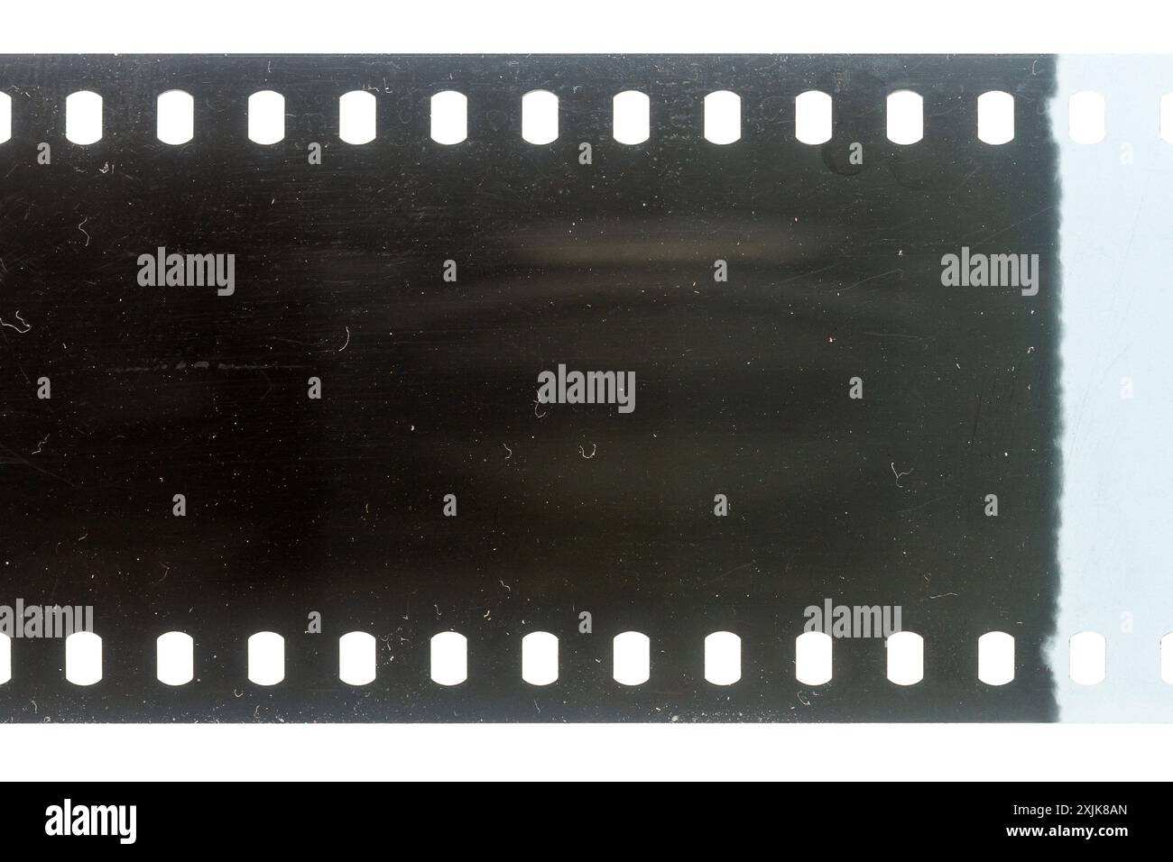 Dusty and grungy 35mm film texture or surface. Perforated scratched ...