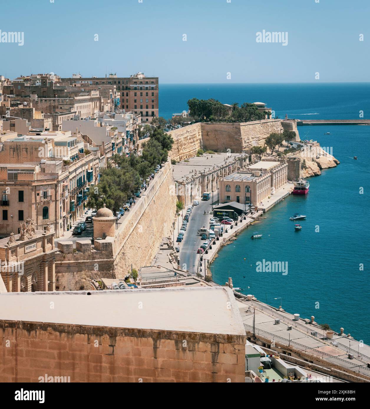 Aerial view of Valletta's coastline featuring historic buildings and ...
