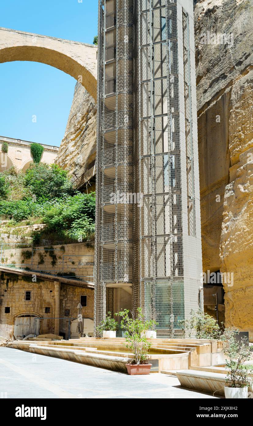 A contemporary elevator structure set within a historic setting ...