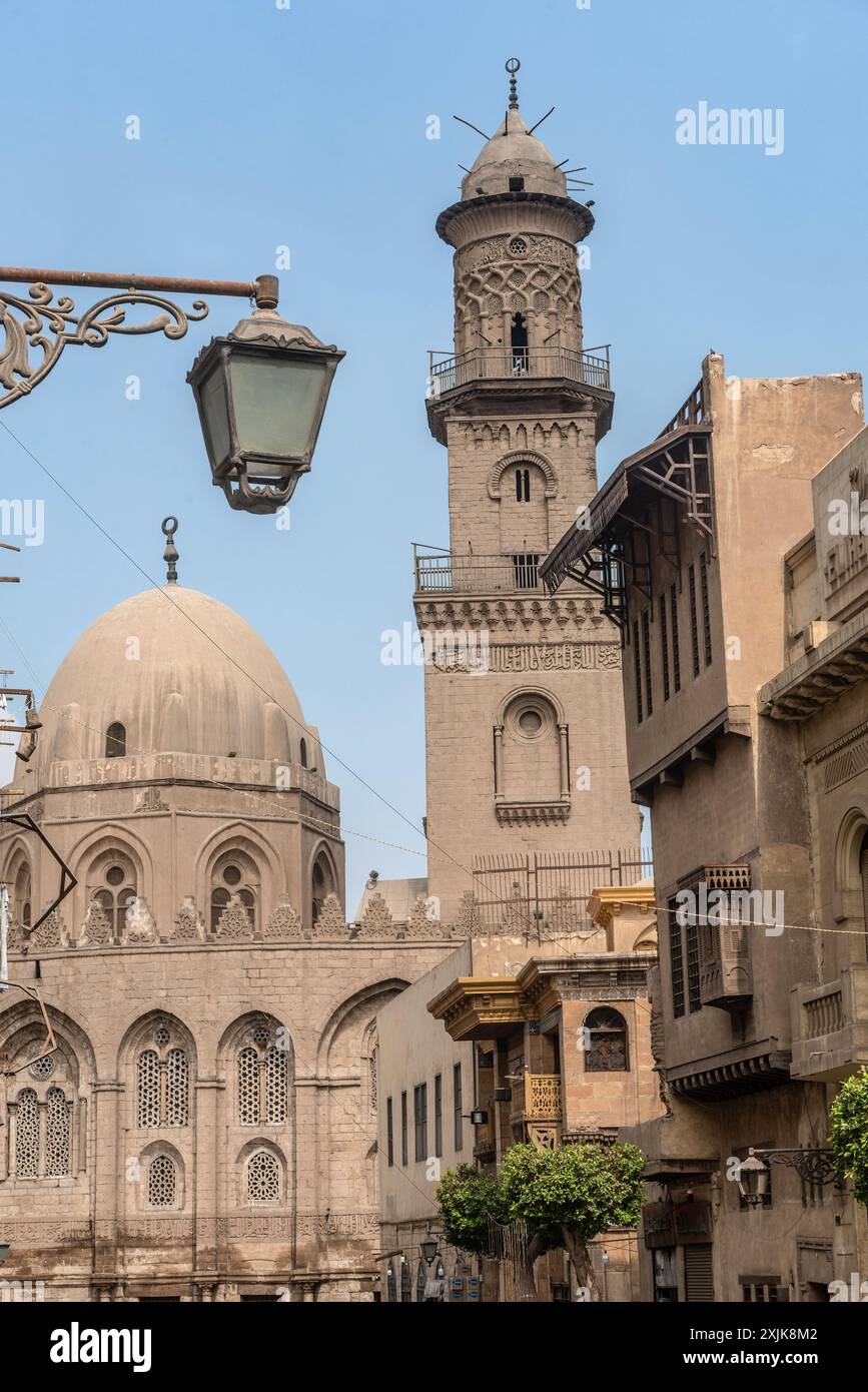 The iconic domes and minarets of the historical buildings in Islamic Cairo along Muiz Street ...