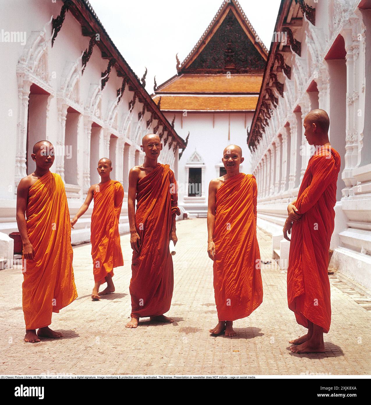 A group of monks dressed in their traditional robes. Thailand 1950s ...