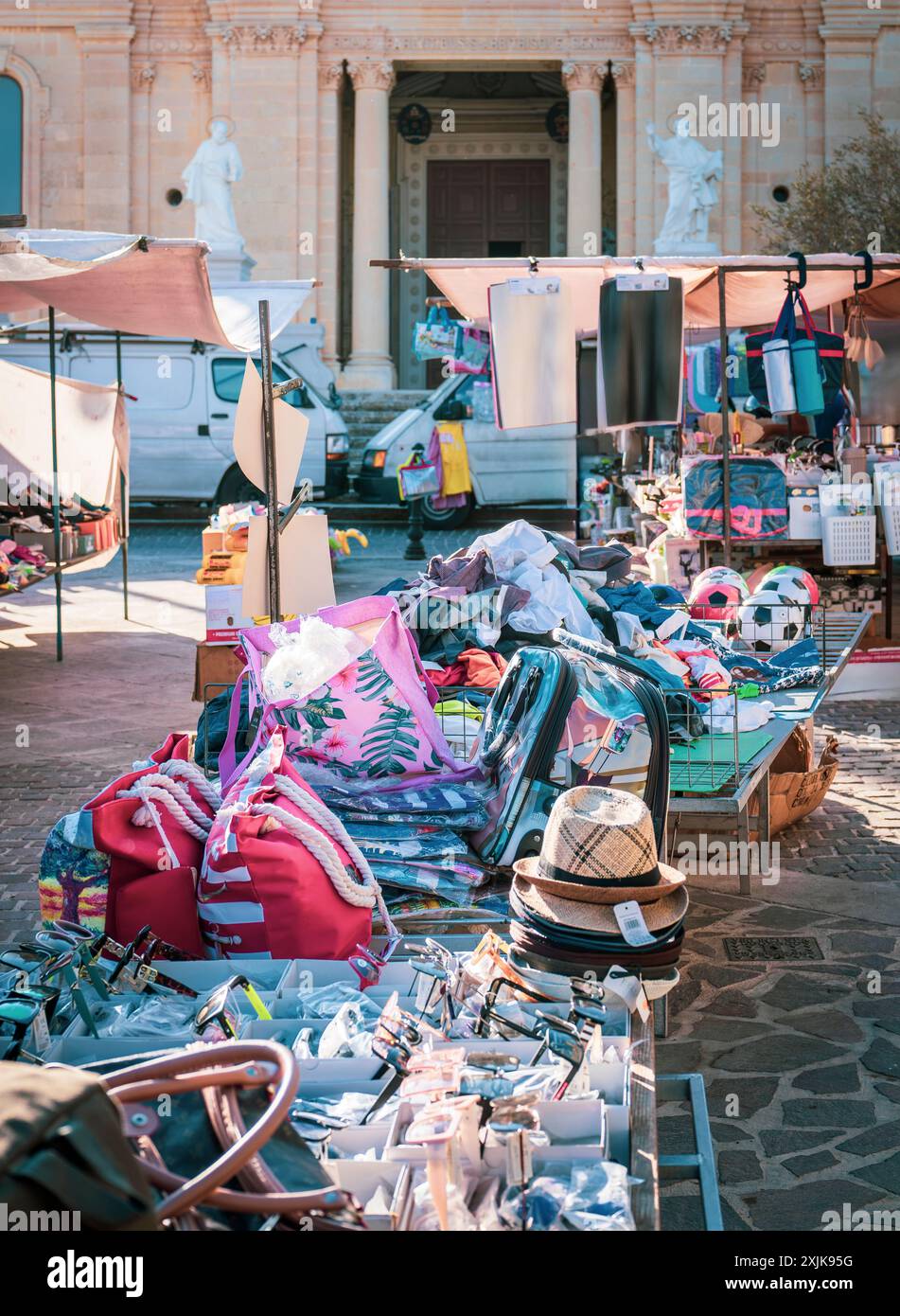 A vibrant outdoor market stall displaying various colorful goods and ...