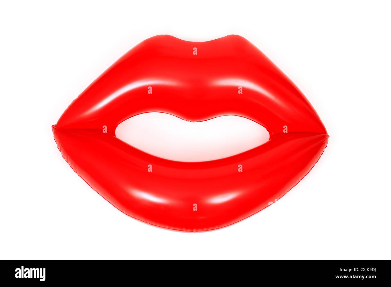 a floaty in the shape of a pair of red lips on a white background Stock ...