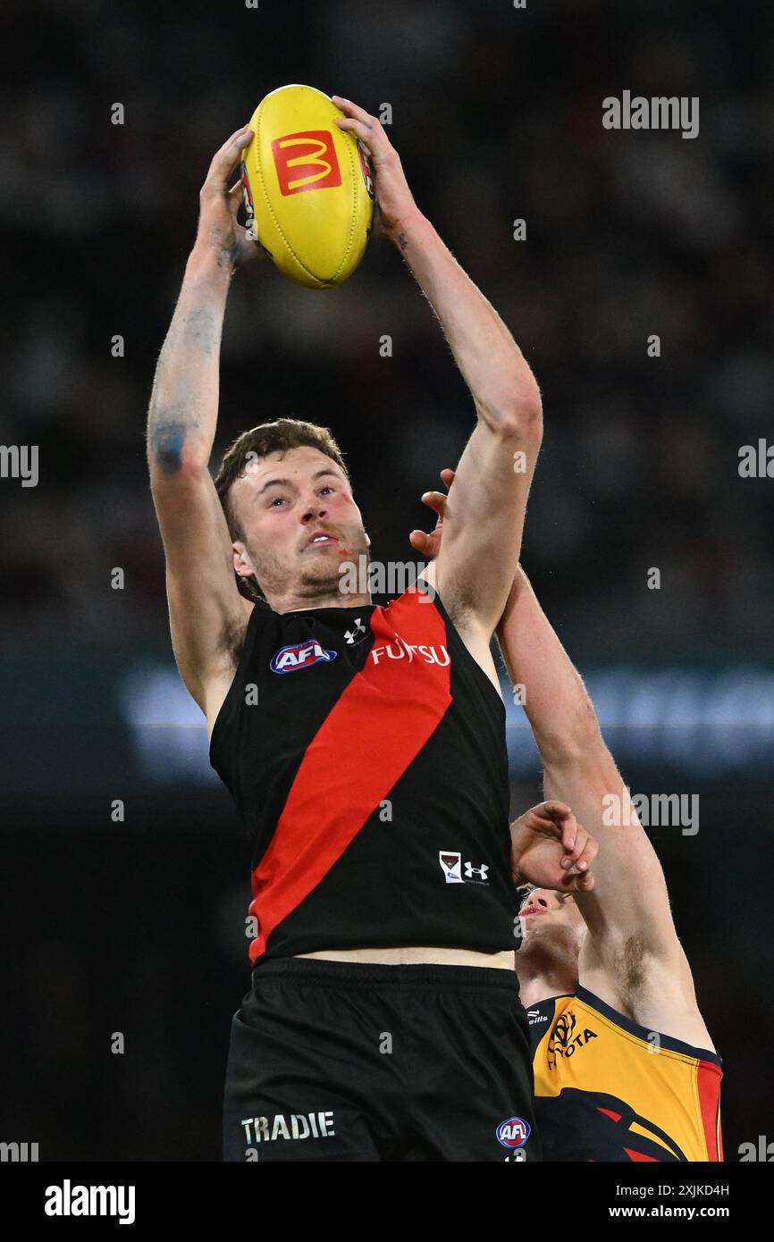 Melbourne, Australia. 19th July, 2024. Nik Cox of Essendon (left) marks ...