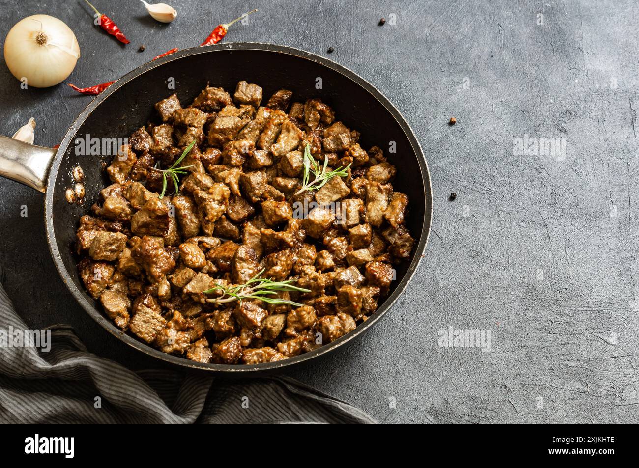 Cooked Fried liver in pan on rustic background, giblets food Stock ...