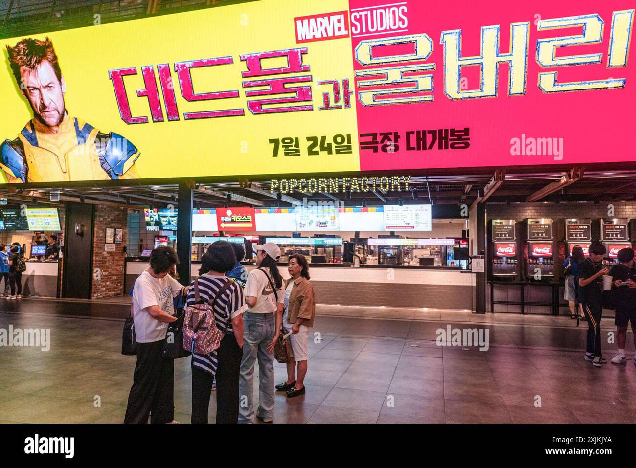 Seoul, South Korea. 19th July, 2024. People stand in front of a ...