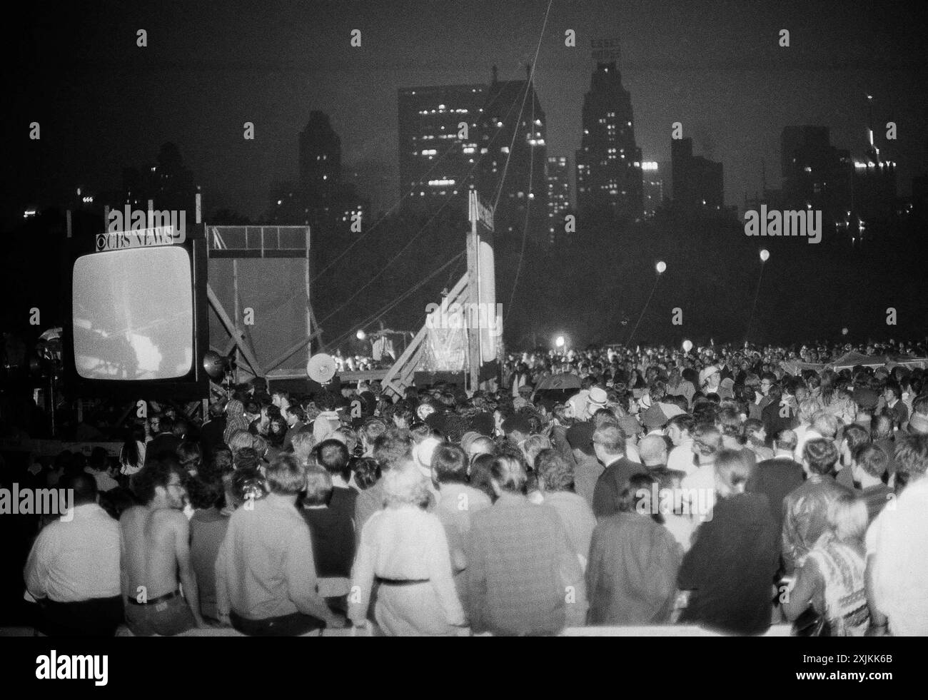 CHANGES TO WALKS, NOT LANDS - FILE - A crowd watches giant television ...