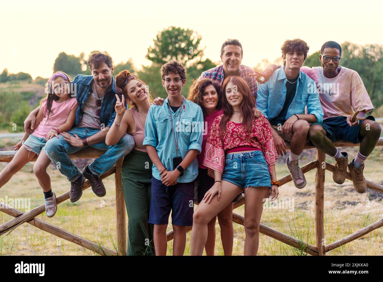 Joyful diverse group of friends and family members enjoying summer ...