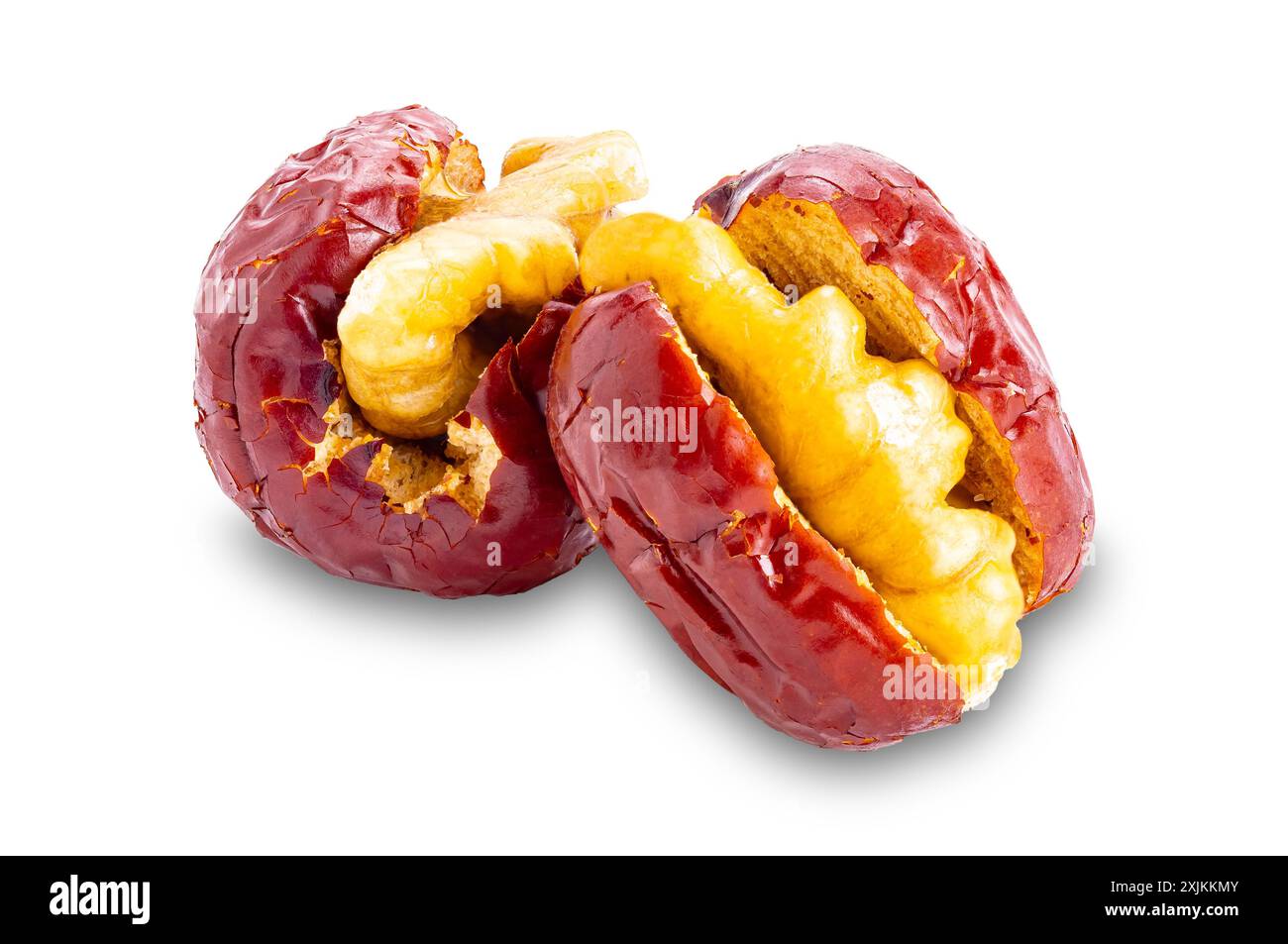 Closeup view of dried red chinese jujube stuffed with walnut isolated ...