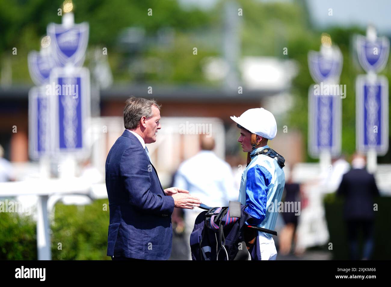 Jockey Alec Voikhansky with trainer Richard Hannon after the Crossland ...