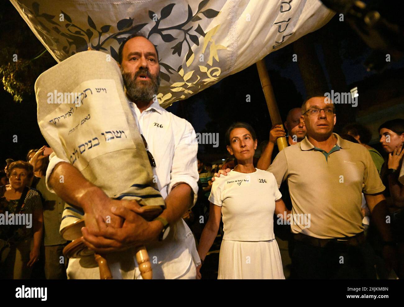 Jon Polin and his wife Rachel Goldberg-Polin (R), the parents of ...