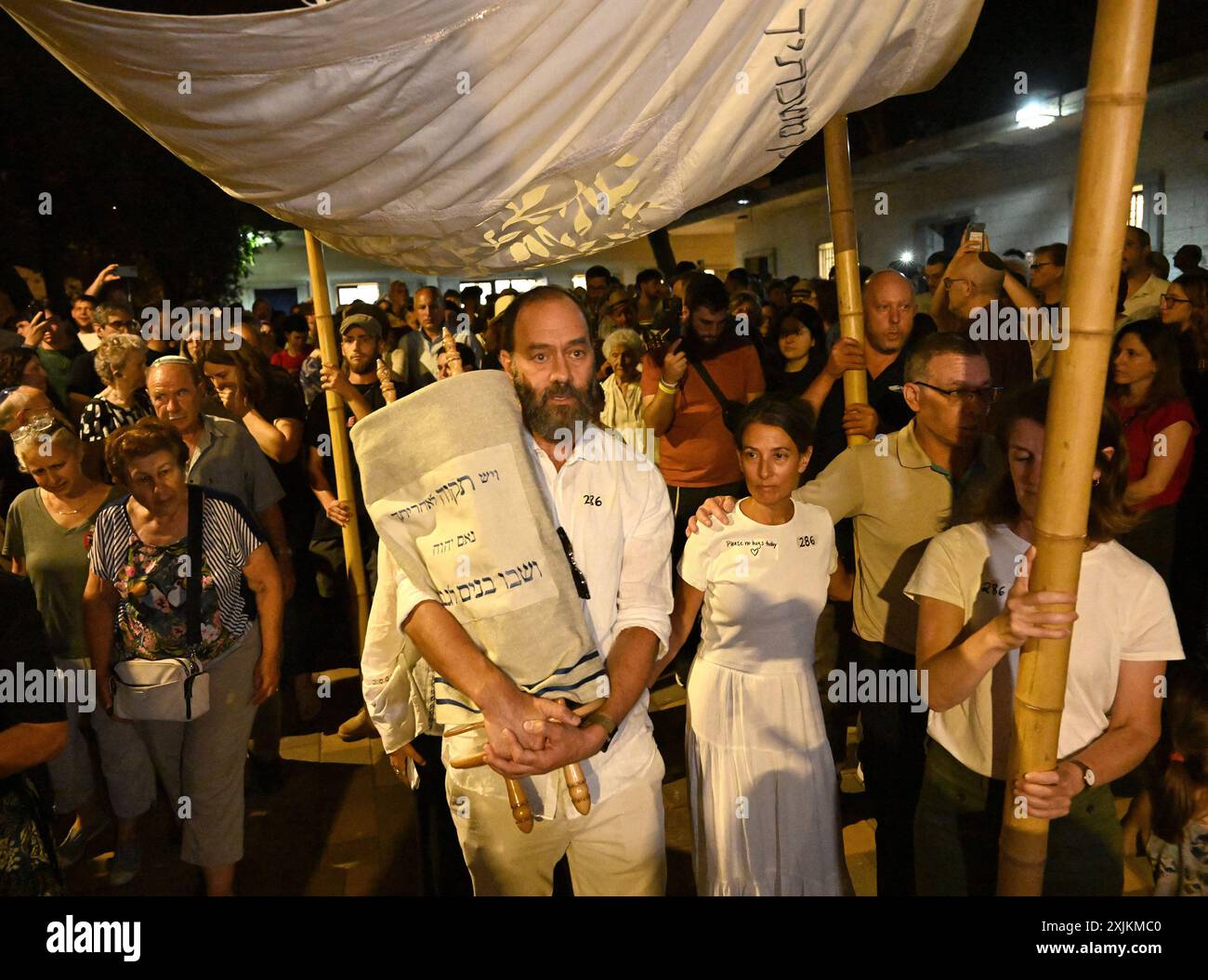 Jon Polin and his wife Rachel Goldberg-Polin (R), the parents of ...