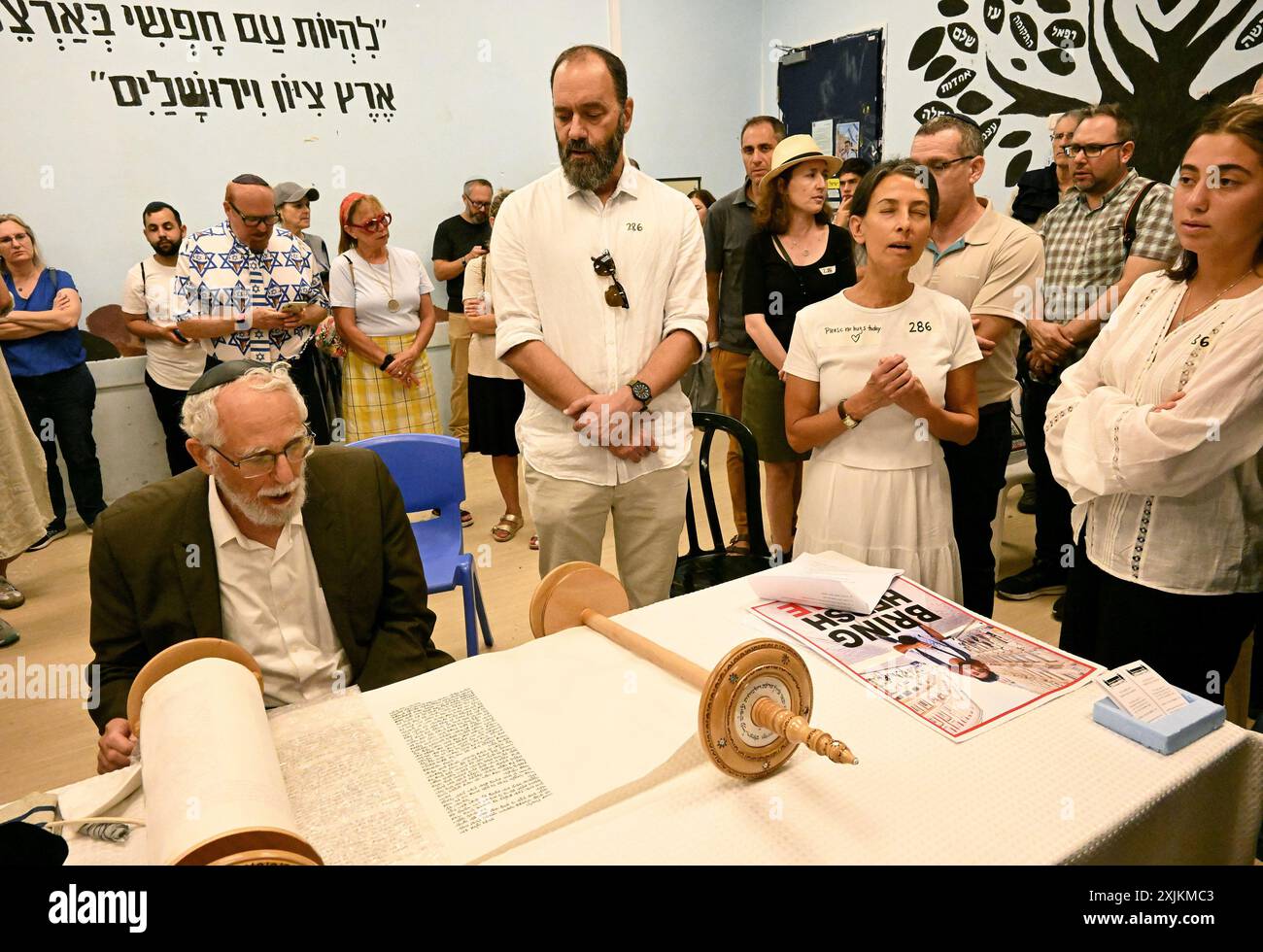 Rabbi Akiva Garber, the Jerusalem Scribe, is joined by (R) Jon Polin and Rachel Goldberg-Polin ...