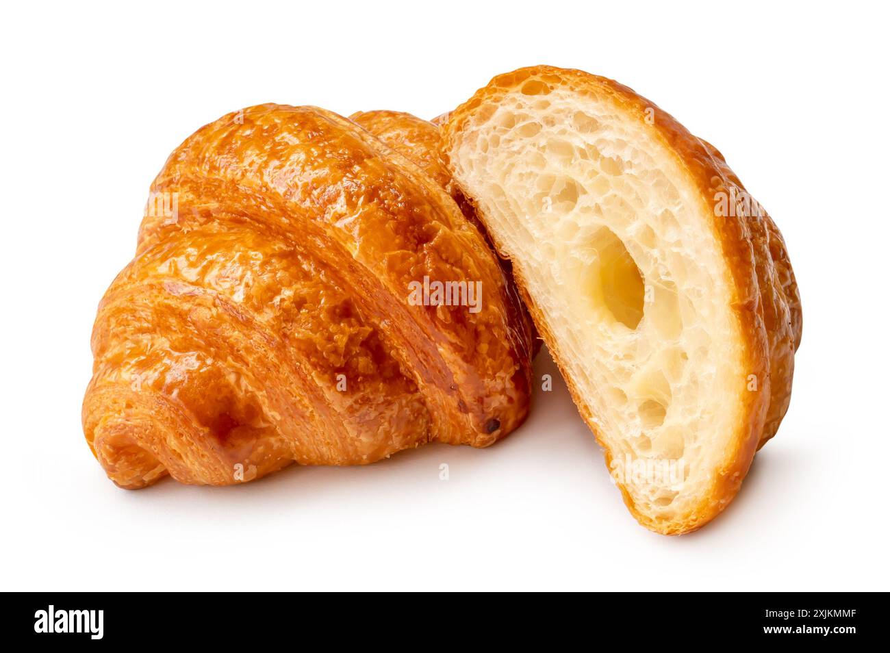 Single brown croissant with half in stack is isolated on white ...