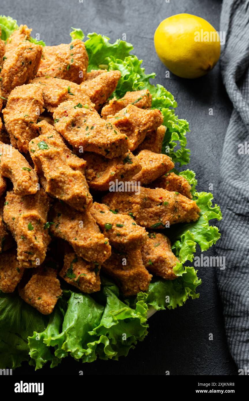Raw meatballs with lettuce on rustic background, Turkish traditional ...